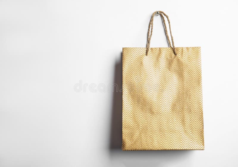 Gold Shopping Paper Bag Isolated Stock Photo - Image of purchase, shop ...