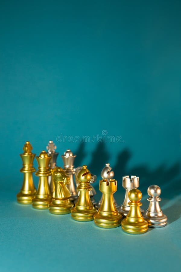 Gold and Silver Chess Pieces on a Blue Background Stock Image - Image ...