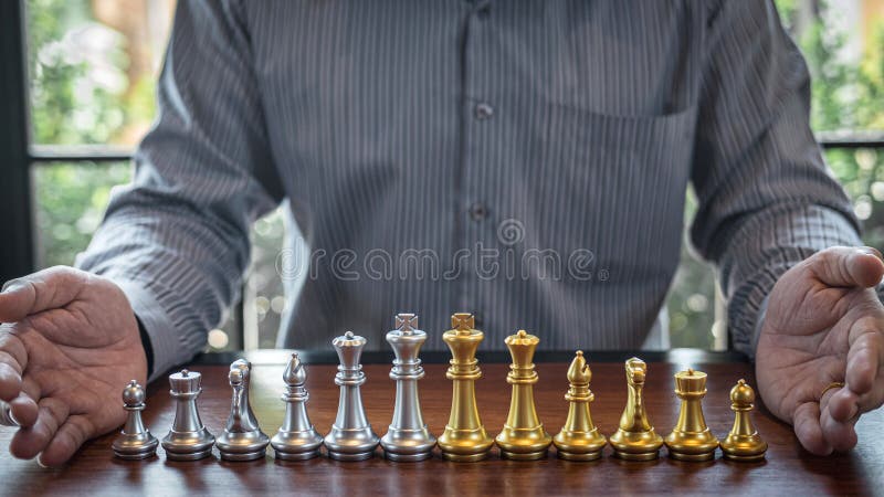 Gold and Silver Chess with Player, Intelligent Businessman Playing ... Gold and Silver Chess with Player, Intelligent Businessman Playing ...