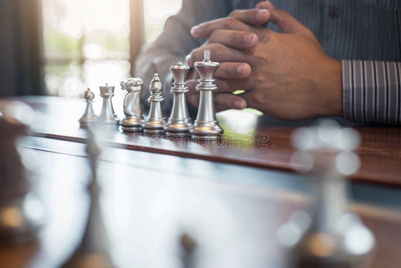 Gold and Silver Chess with Player, Intelligent Businessman Playing ... Gold and Silver Chess with Player, Intelligent Businessman Playing ...