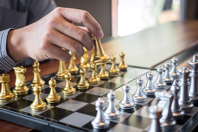 Gold and Silver Chess with Player, Intelligent Businessman Playing ... Gold and Silver Chess with Player, Intelligent Businessman Playing ...