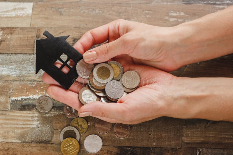Gold, Silver Coins and Decorative House in the Hands Stock Image ...