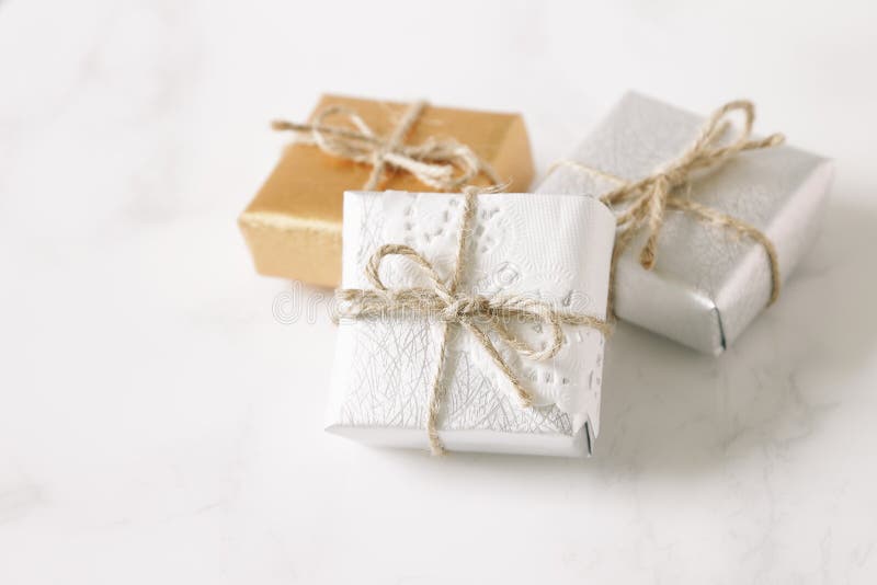 Gold and Silver Gift Boxes on Table Stock Image - Image of shopping ...