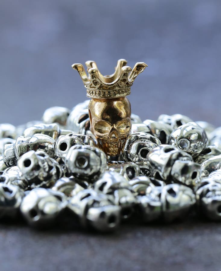 Gold Skull among Ordinary Metal Skulls Stock Photo - Image of metal ...