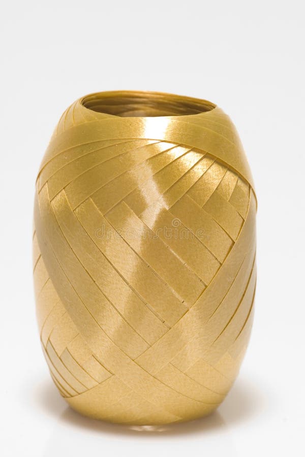 A gold spool of ribbon stock image. Image of giftwrapping - 7405825