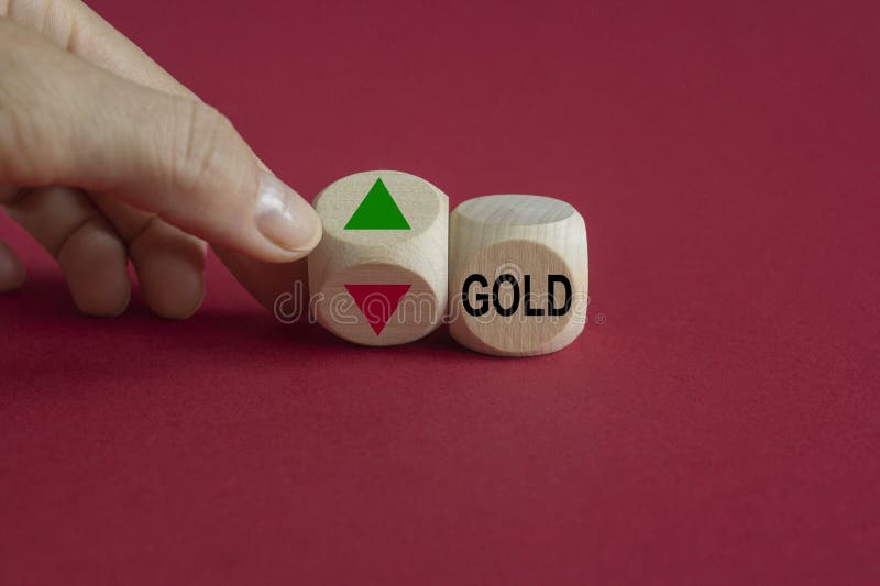GOLD Symbol . Hand is Turning a Cube and Changes the Direction of an ...