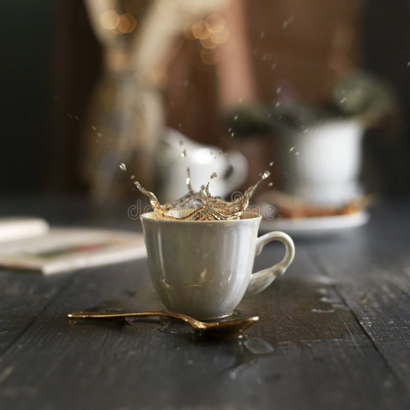 Gold tea splash stock image. Image of dessert, tableware - 223826645