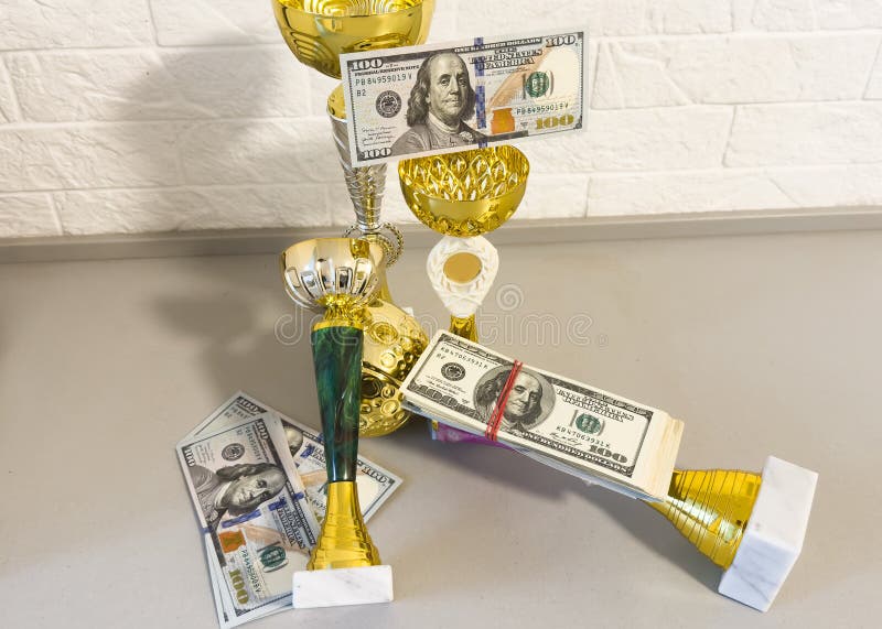 Gold Trophy Cup on a Bunch of Cash Stock Image - Image of success, gold ...