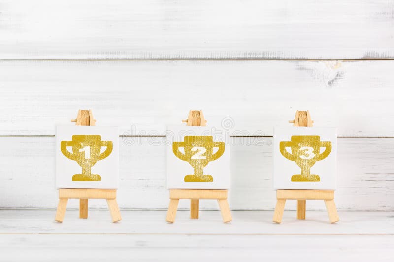 Gold Trophy Icons for First, Second, and Third Place on Wooden Easels ...