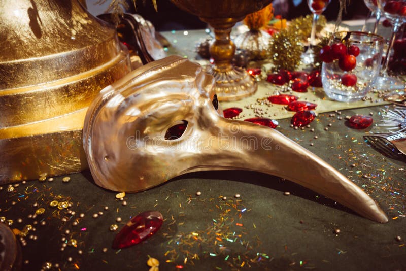 Gold Venetian Mask on a Table Stock Photo - Image of festive, mystery ...