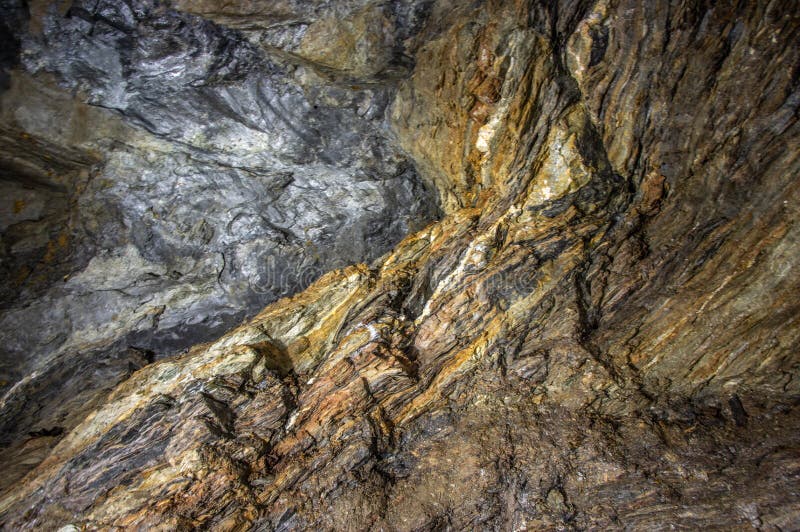Golden Rock Stone Detail, Gold Texture With Mountain Background Stock ...