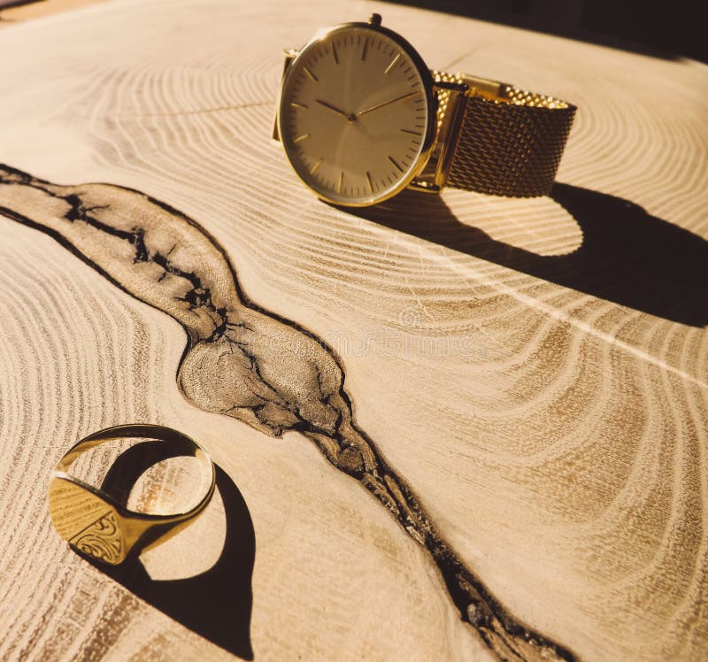 Gold Watch and Signet on Wooden Background Stock Photo - Image of wood ...