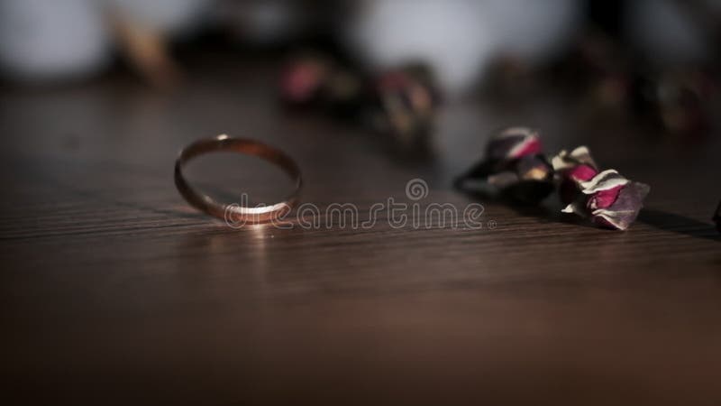 Gold Wedding Ring Falls on the Table in Slow Motion Stock Video - Video ...