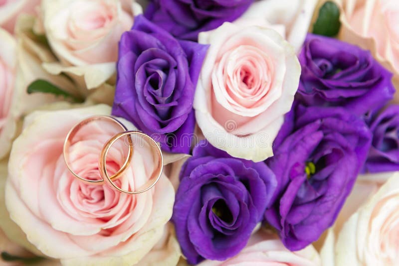 Gold Wedding Rings the Groom and the Bride on a Bunch of Flow Stock ...