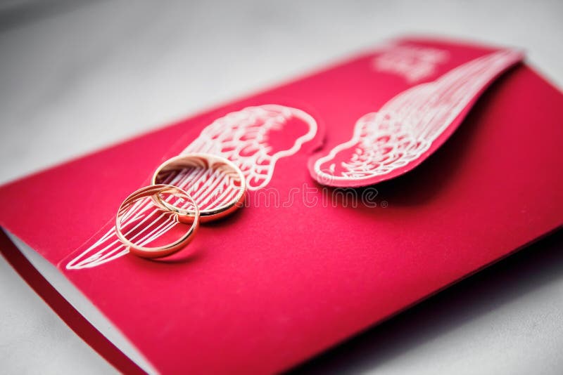 Gold Wedding Rings on a Red Envelope Stock Photo - Image of botany ...