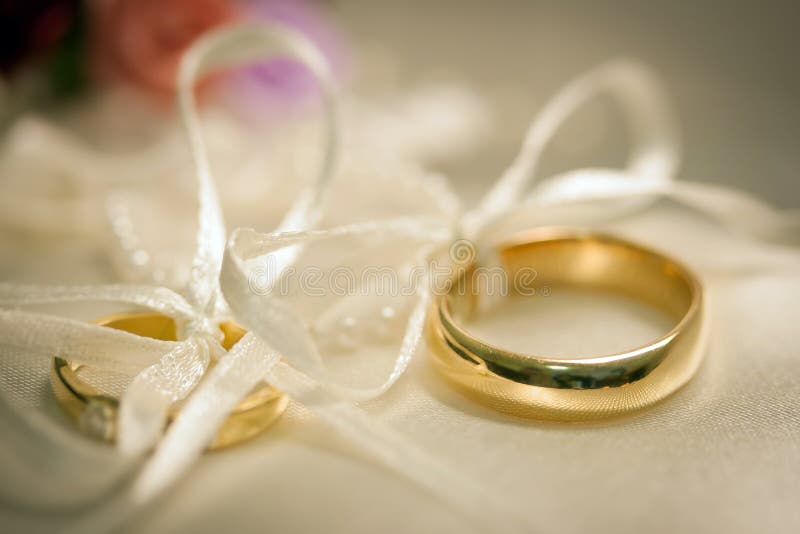 Gold Wedding Rings and Ribbon Stock Image - Image of tied, jewelery ...