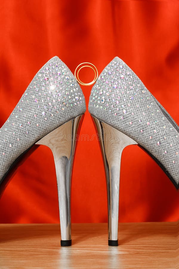 Gold Wedding Rings and Shoes Stock Photo - Image of hand, elegance ...