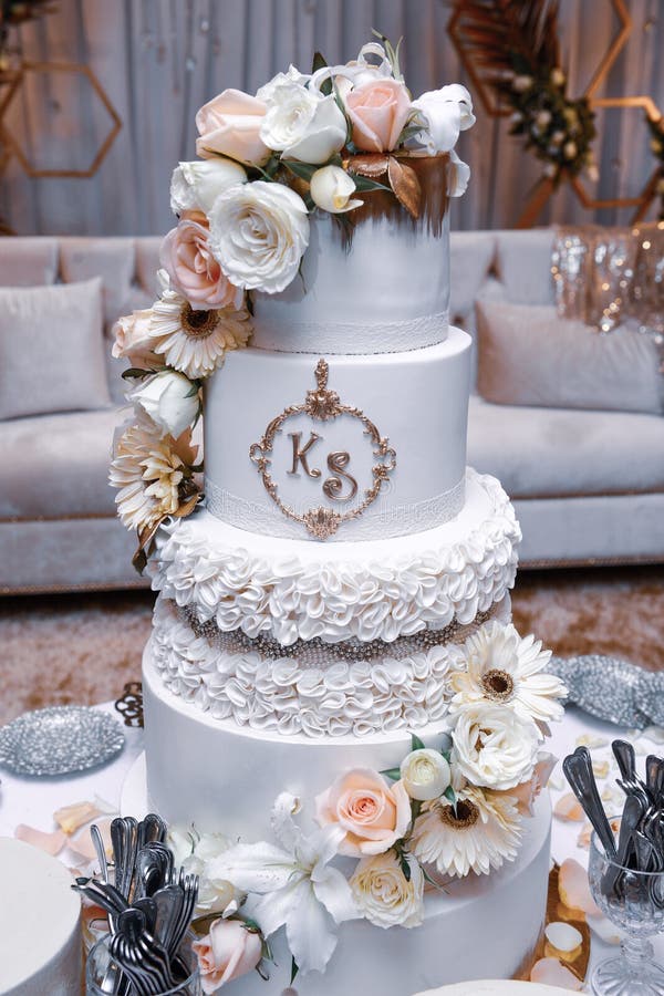 Gold White Pink Tiered Wedding Cake with Roses Stock Photo - Image of ...