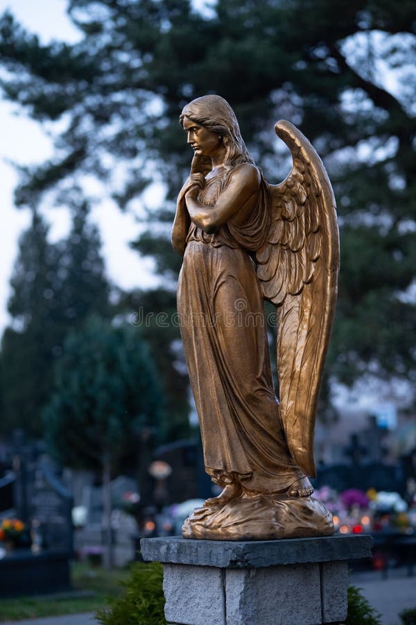 Golden Angel Sculpture in the Graveyard Stock Image - Image of ...