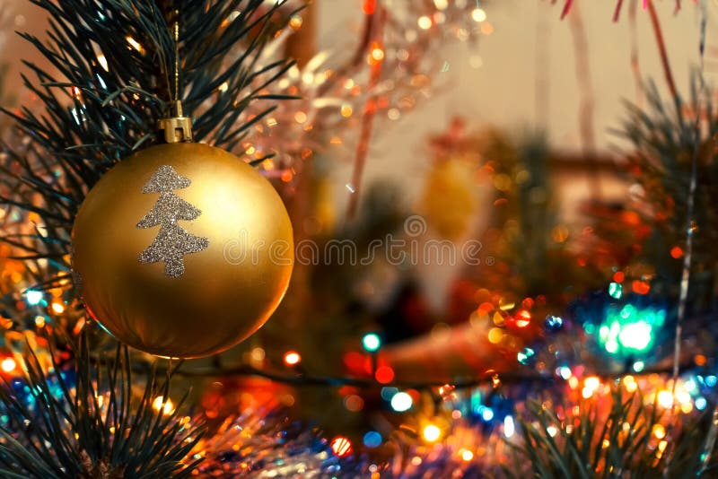 Golden Ball with Silver Painted Tree Hanging on a Christmas Tree among ...