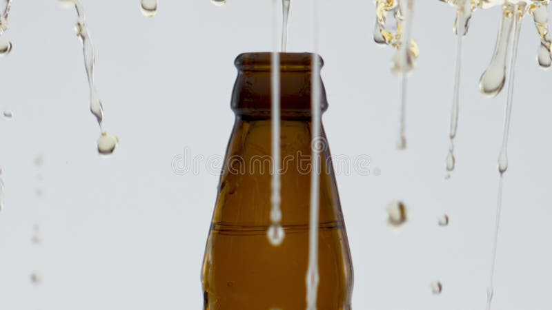 Golden Beer Splashing Bottle after Opening in Super Slow Motion Close ...