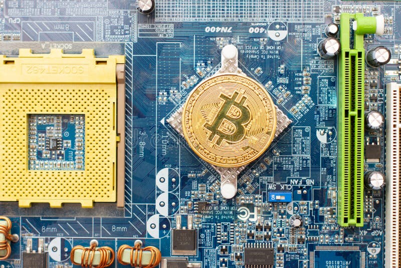 Golden Bitcoin on the Circuit Main Computer Board. Digital Currency ...