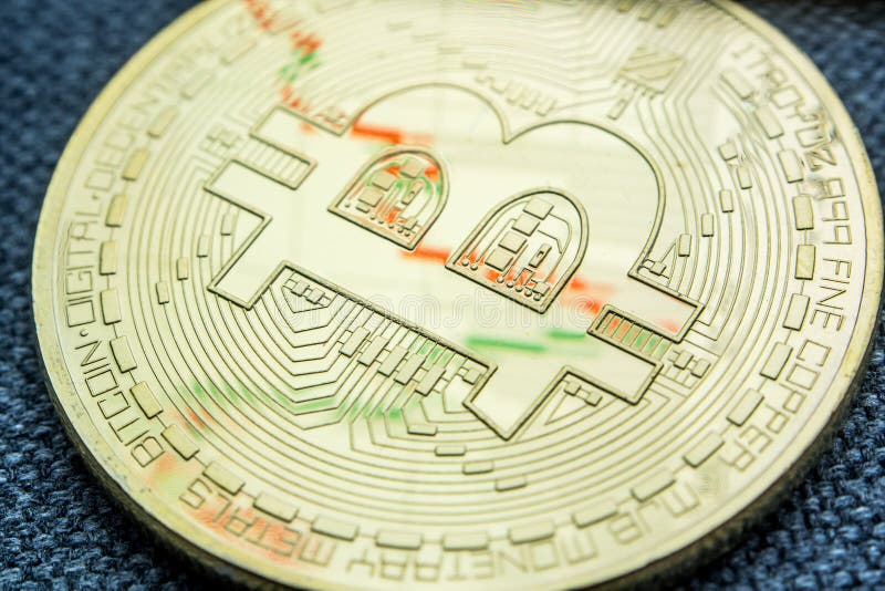 Golden Bitcoin Coin with a Chart Reflection on Its Surface Stock Photo ...