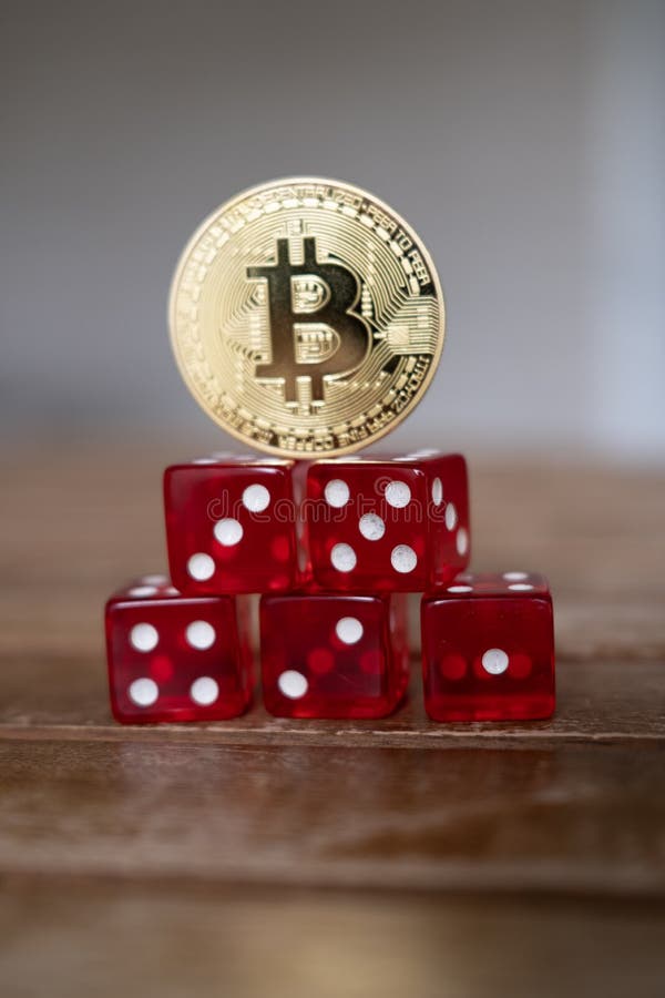 Golden Bitcoin Coin Stands on a Stack of Red Dice Stock Photo - Image ...
