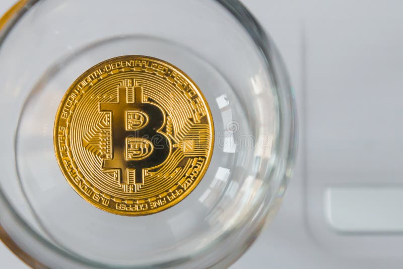 Golden Bitcoin in a Cocktail Glass Close-up Stock Image - Image of ...