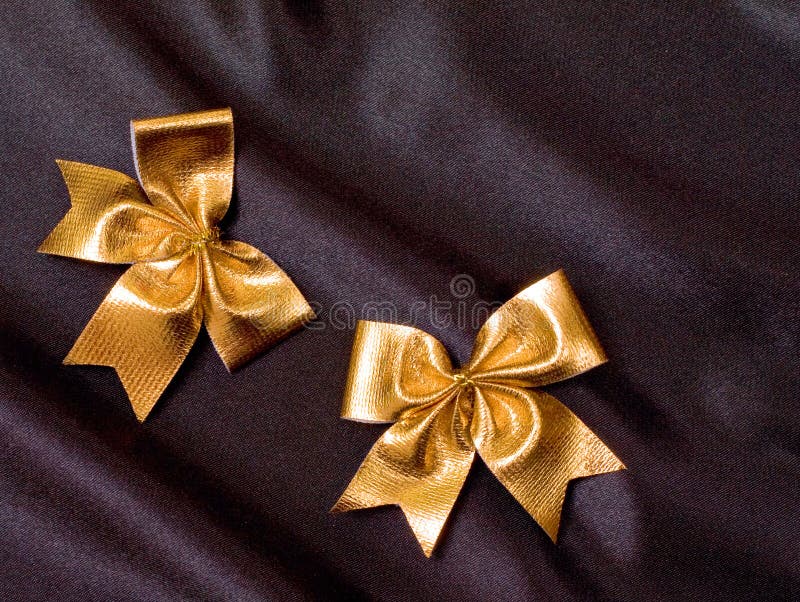 Golden bow stock image. Image of black, silk, christmas - 11886017