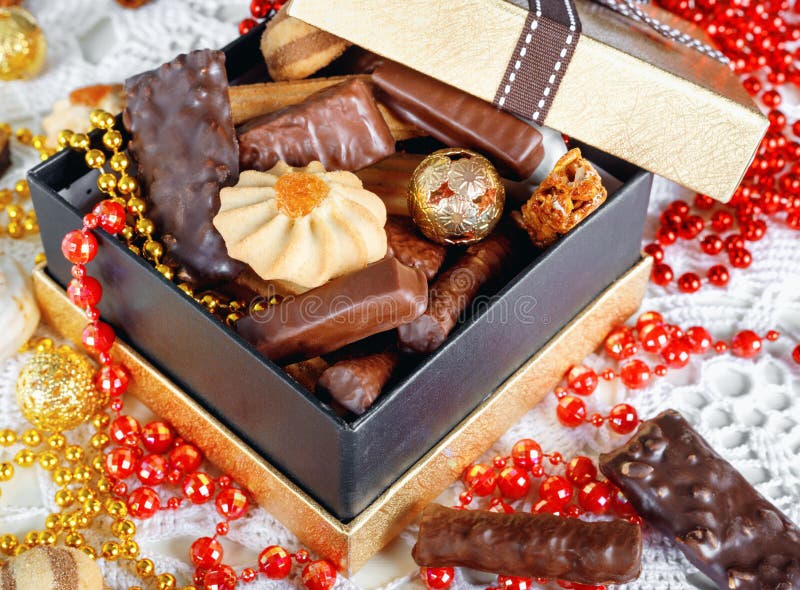 Golden Box of Chocolates, Cookies and Biscuits on Festive Table Stock ...