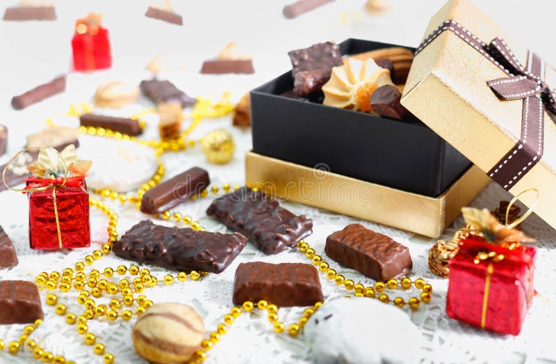 Golden Box of Chocolates, Cookies and Biscuits on Festive Table Stock ...