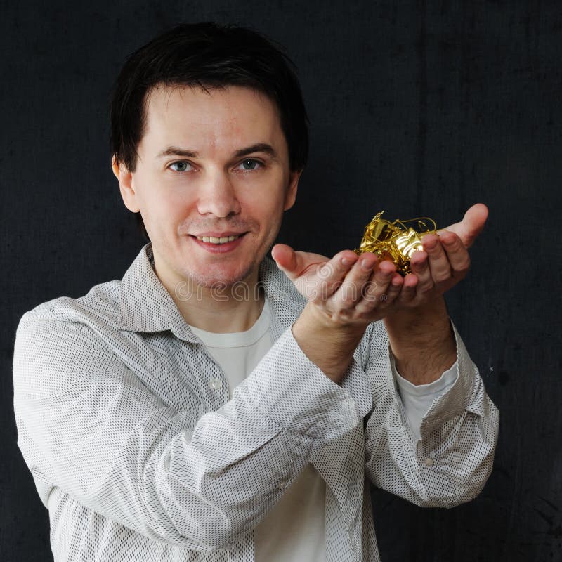 Man with big golden box. stock photo. Image of looking - 18000962