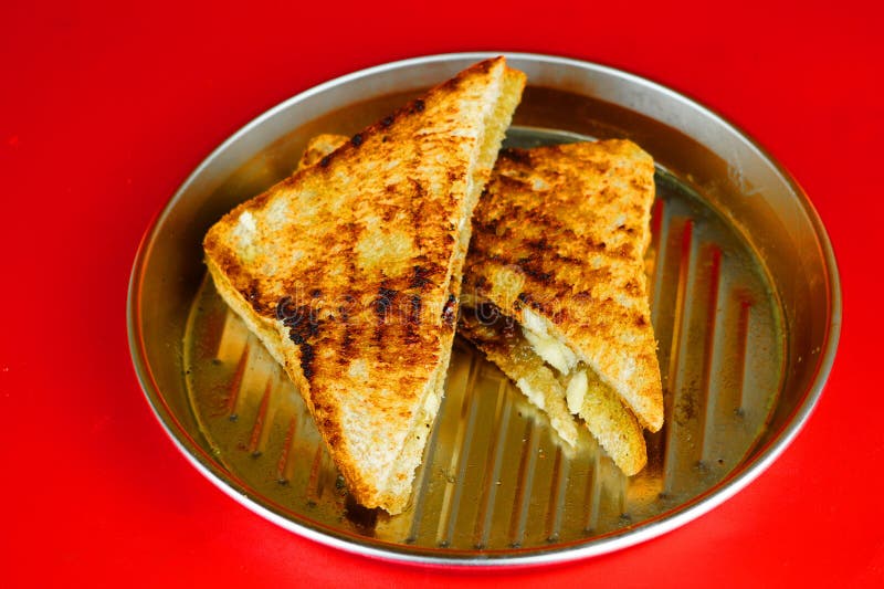 A Golden Brown Grilled Cheese Sandwich on a Rectangular Metal Plate ...