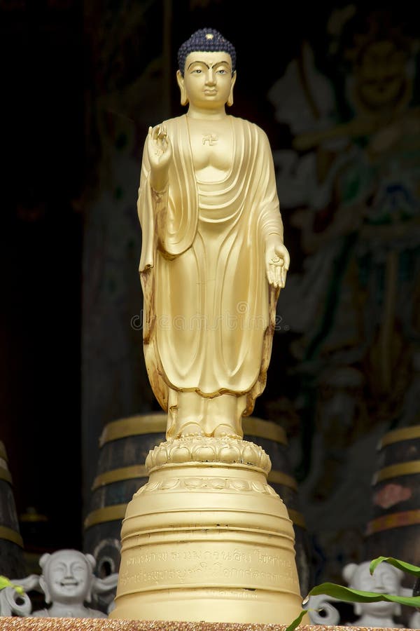 Golden Buddha Statue in Standing Posture. Stock Image - Image of bronze ...
