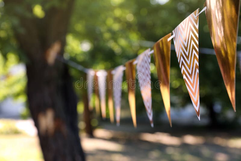 Golden Bunting Flags in Park. Party Decor Stock Image - Image of ...