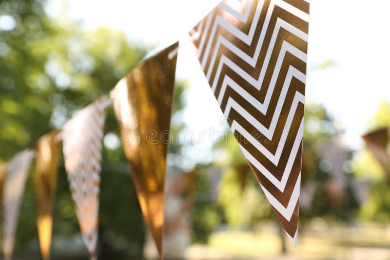 Golden Bunting Flags in Park. Party Decor Stock Photo - Image of ...