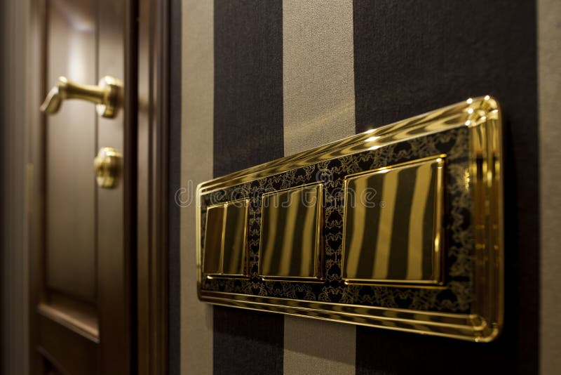 Golden button Light Switch stock photo. Image of comfortable - 50776850