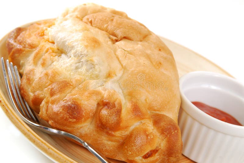 Golden Calzone stock photo. Image of baked, plate, italian - 16497294