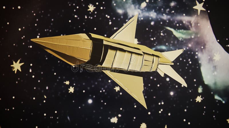 Golden Cardboard Rocket Ship Soaring through Space Galaxy Background ...