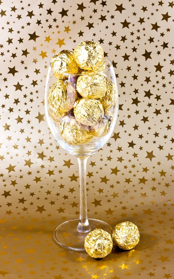 Gold wrapped chocolates stock image. Image of wrapped - 22735687