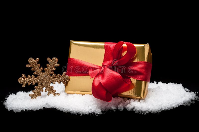 Golden Christmas Gift in Snow Stock Image - Image of festive, concept ...