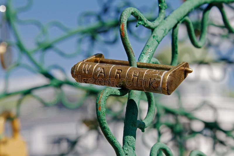 Golden Code Lock Hanging on Metal Tree Closeup Stock Photo - Image of ...