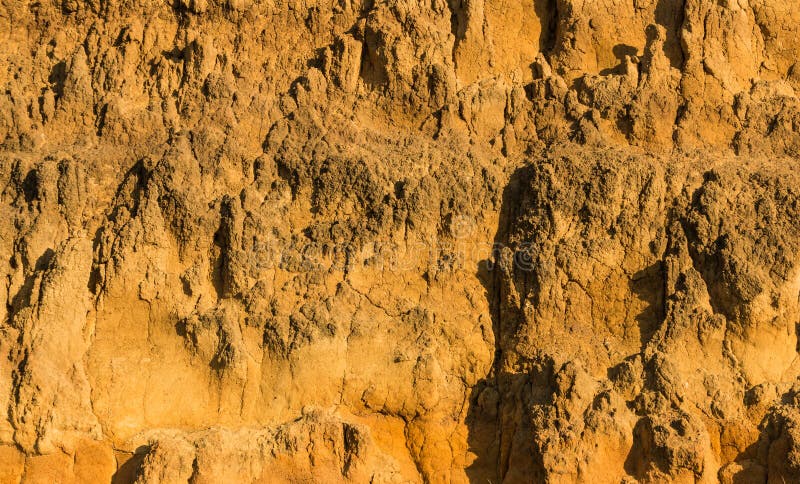 Golden Color Dirt Cliff stock photo. Image of clay, texture - 49664290