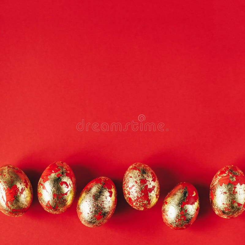 Golden Colored and Decorated with Sparkles Easter Eggs on Red ...