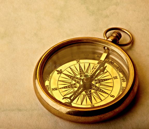Golden compass stock photo. Image of direction, close - 21960508