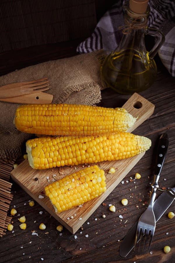 Golden Corn Cob with Oil, Herbs and Salt on Wooden Table Stock Image ...
