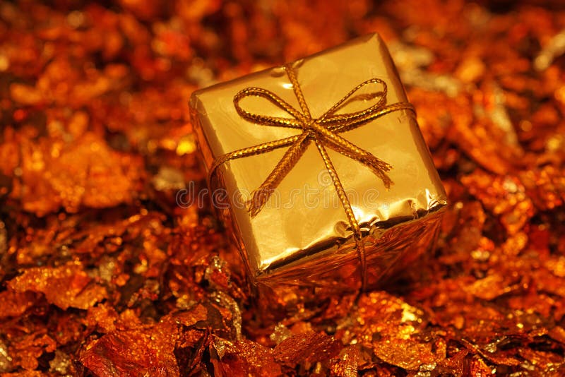 Golden Decorative Box with Holiday Gift on Red Background Stock Image ...
