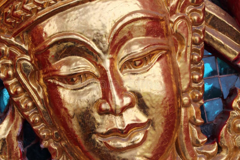 Golden Deva face stock photo. Image of decoration, creed - 22061312