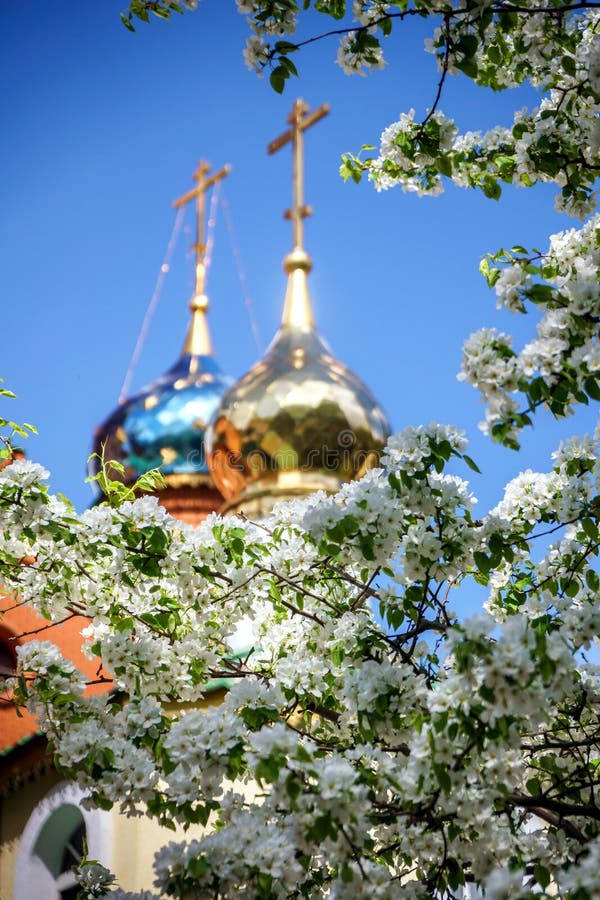 A Golden Dome with a Cross Surrounded by Spring Flowers Stock Image ...